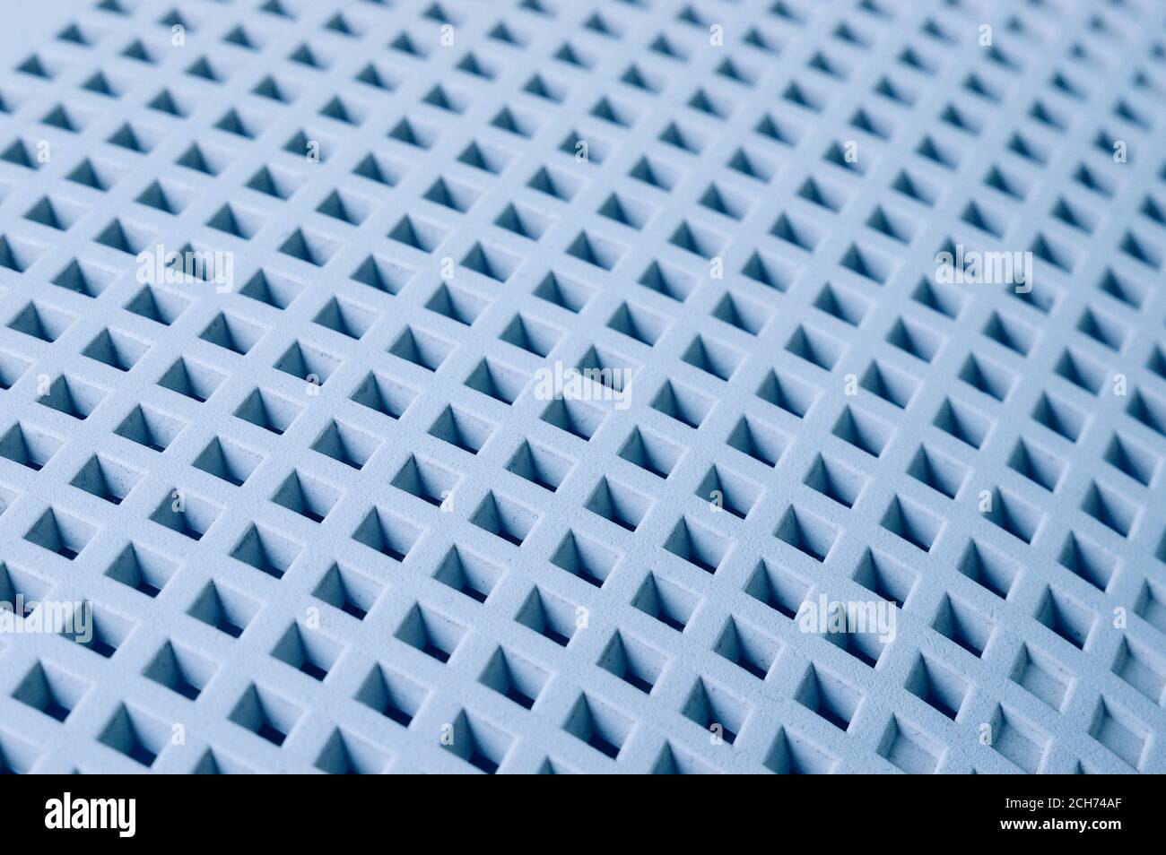 Closeup of technological plastic texture with repeating patterns and ...