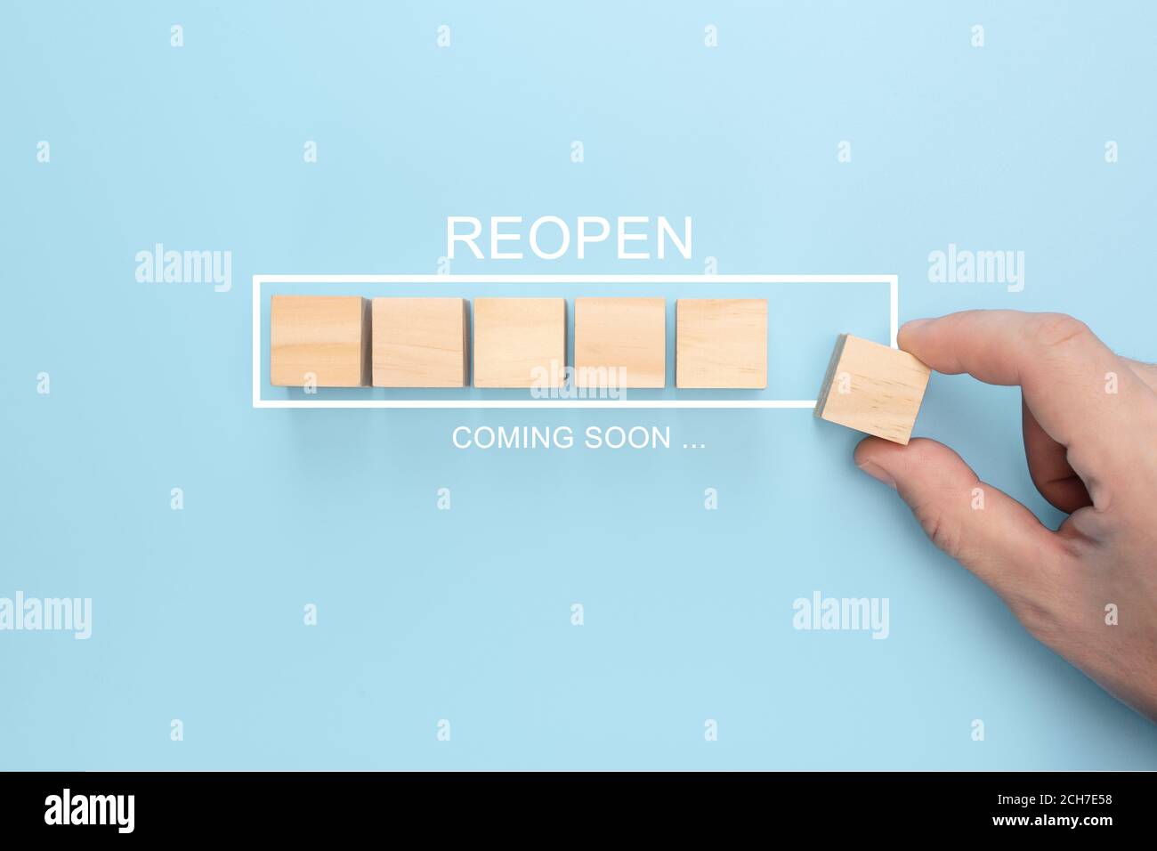 Hand putting wooden cube on virtual infographic loading bar with REOPEN ...