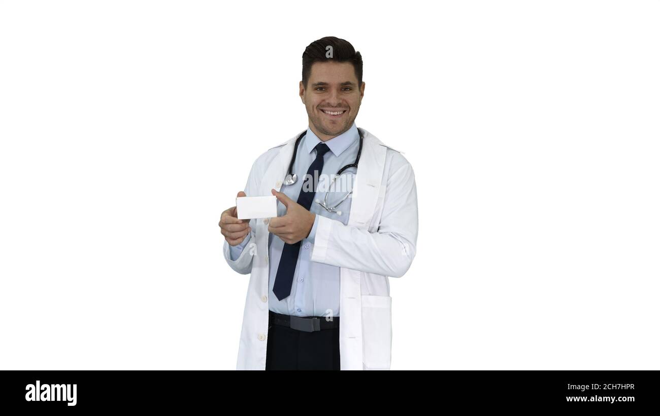 Doctor presenting vitamins and talking about them to camera on white ...