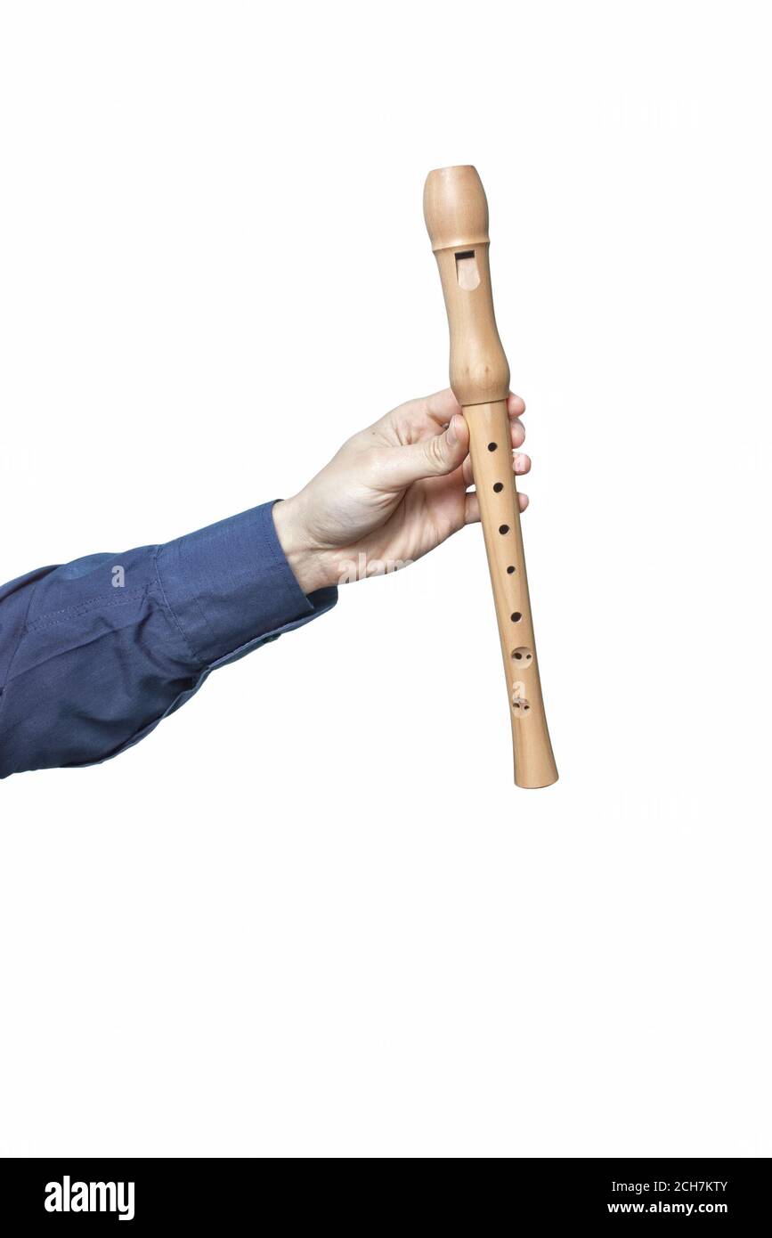 Arm of a man in blue shirt sleeve holding block flute isolated on white ...