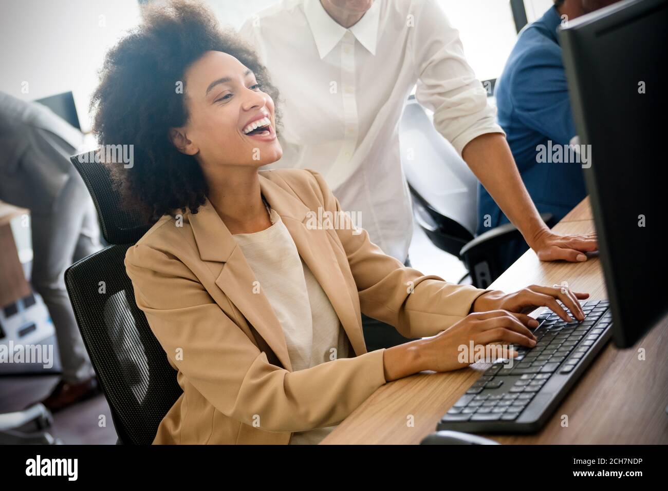 Happy business people having fun and chatting at workplace office Stock ...