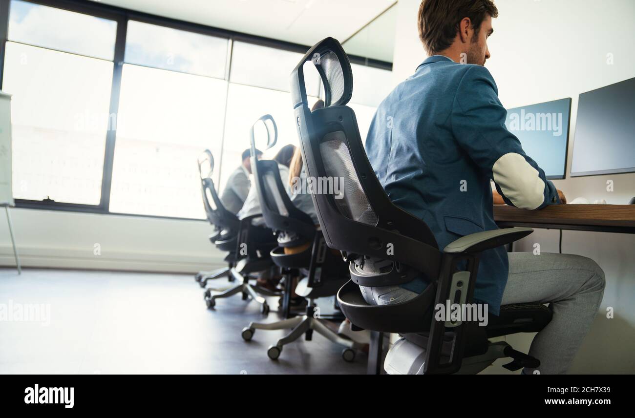 Software engineers working on project and programming in company Stock ...