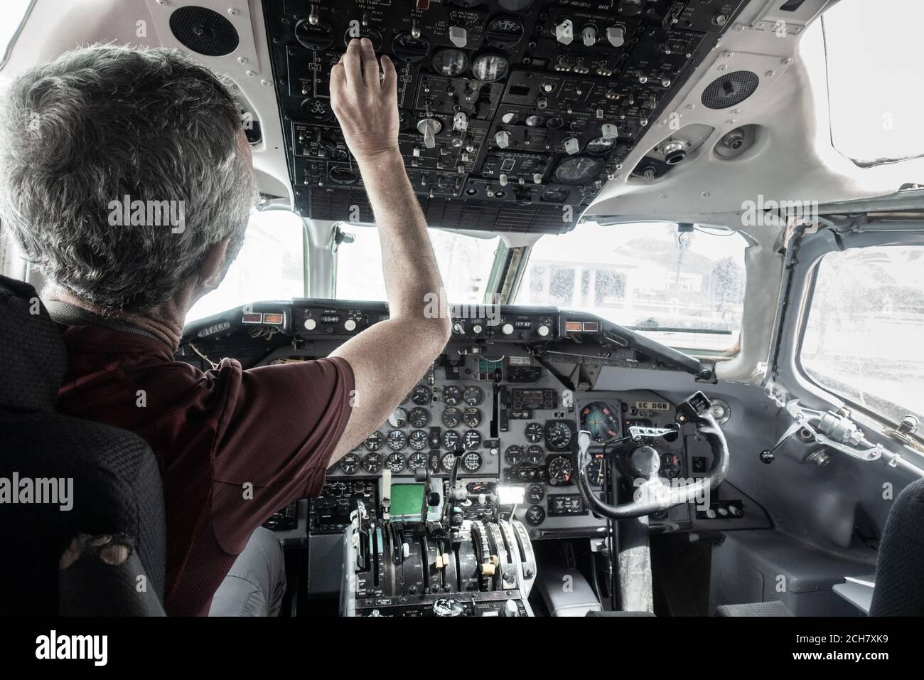 Man in cockpit of airplane in science museum Stock Photo - Alamy