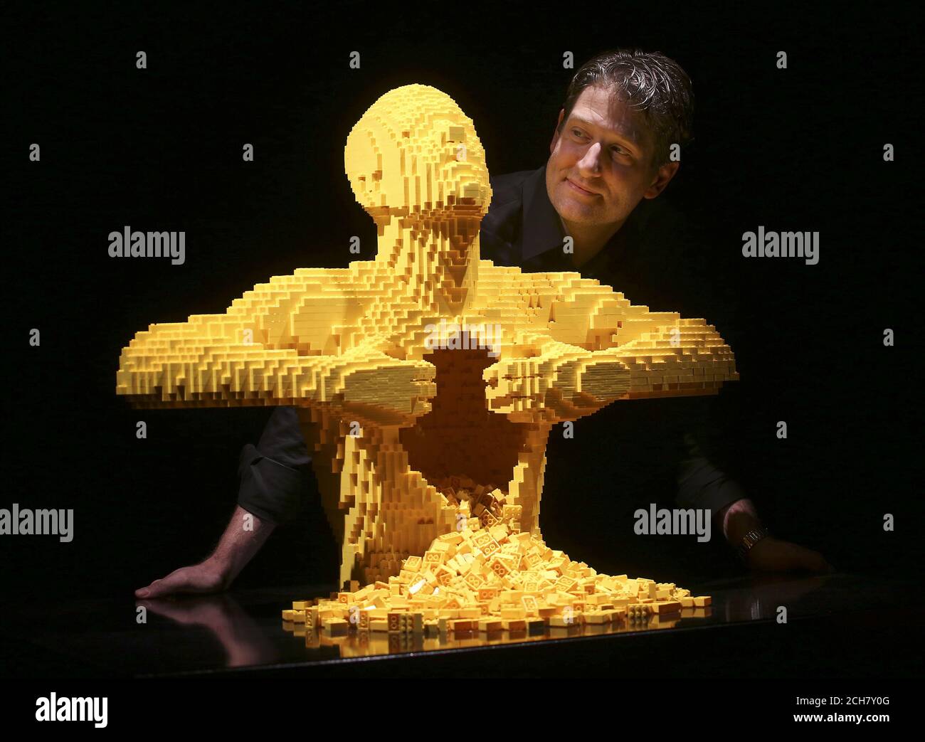 Artist Nathan Sawaya with one of his exhibits at The Art of the Brick ...