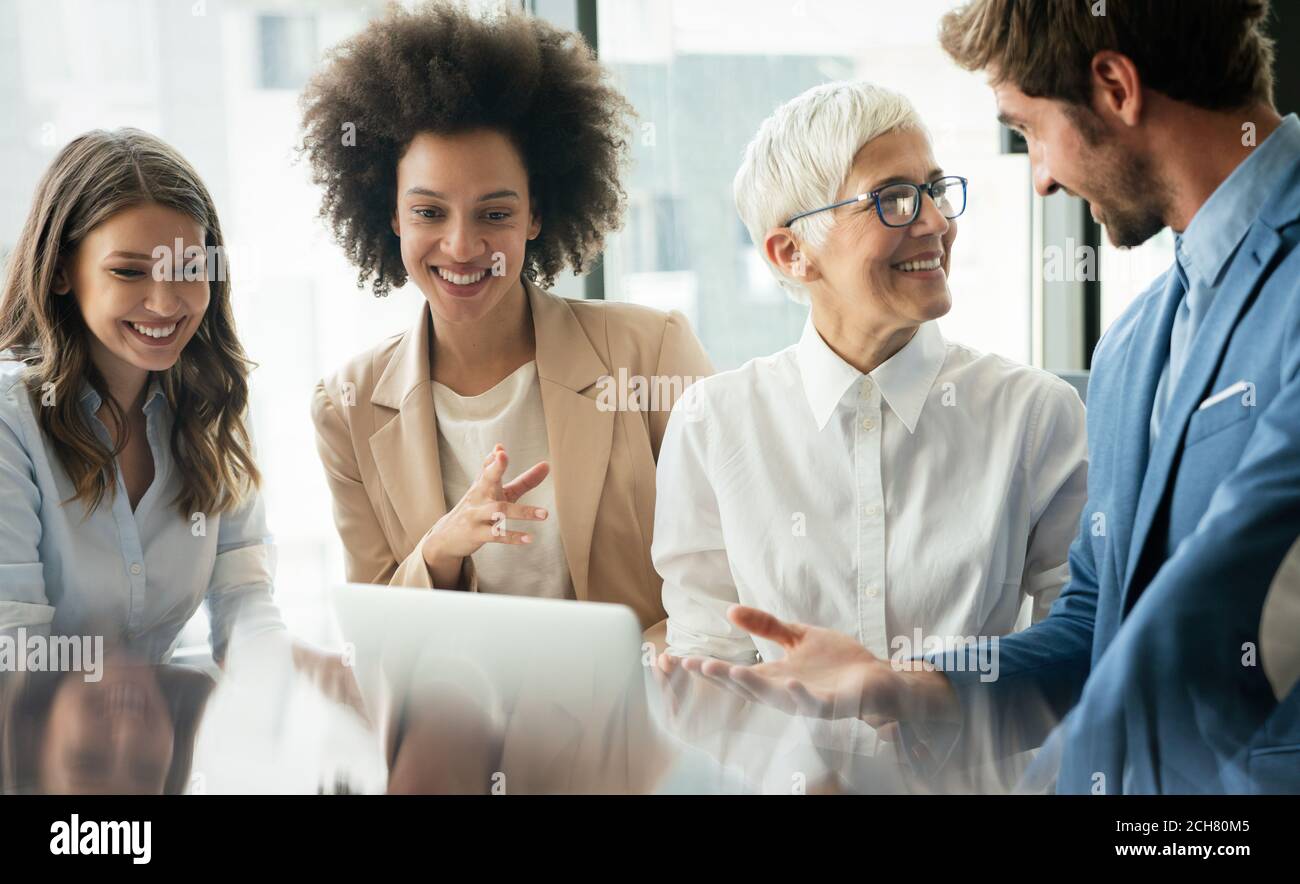 Business colleagues in conference meeting room during presentation ...