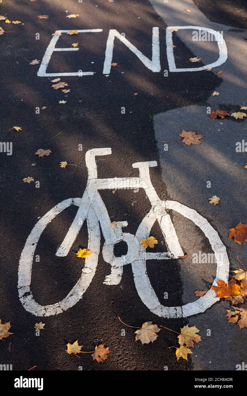 End of bicycle or cycle lane sign painted on a path or pavement Stock ...