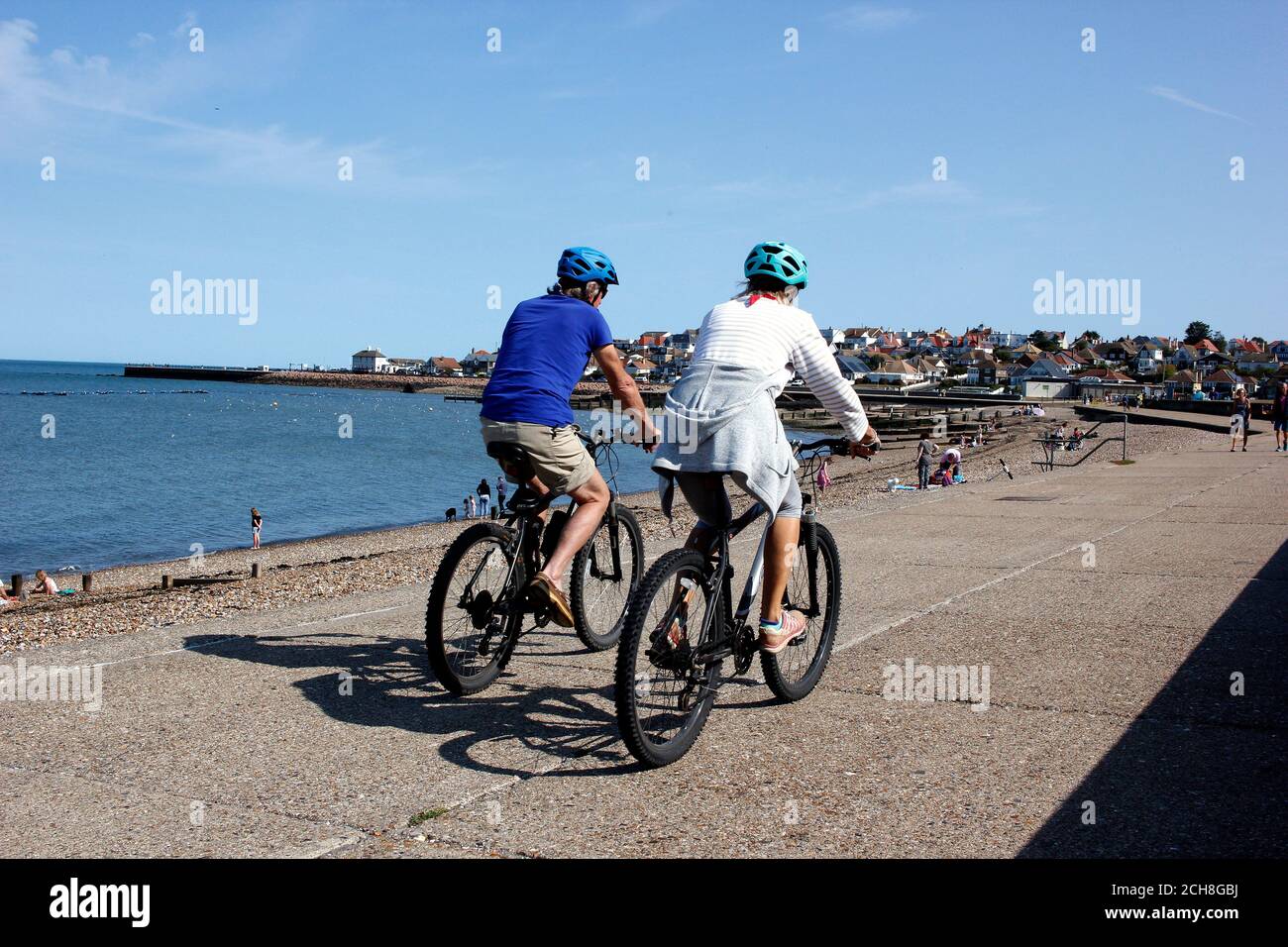 male cyclists cycling on the seafront path in hampton-on-sea east kent ...