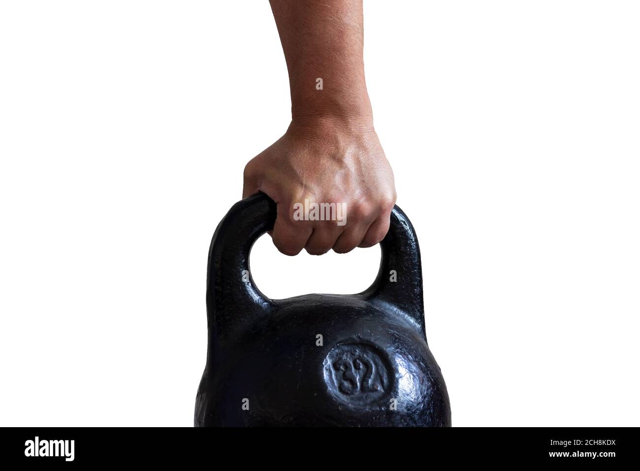 Male hand holding black cast iron sports kettlebell isolated Stock ...