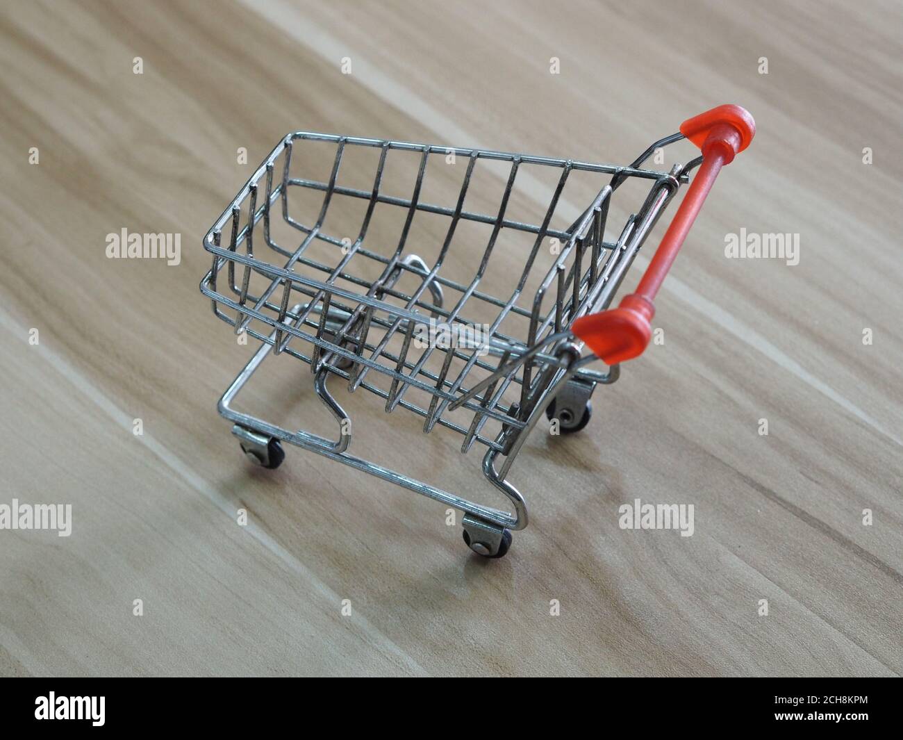 mini model cart supermarket on wooden desk Stock Photo - Alamy