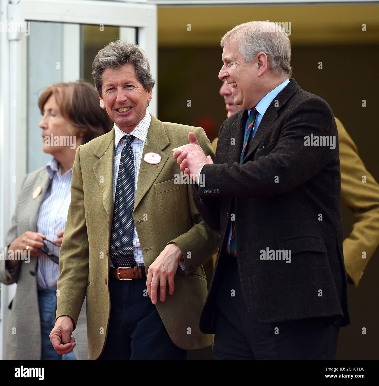The Duke of York (right) shares a joke with the Queen's racing manager ...