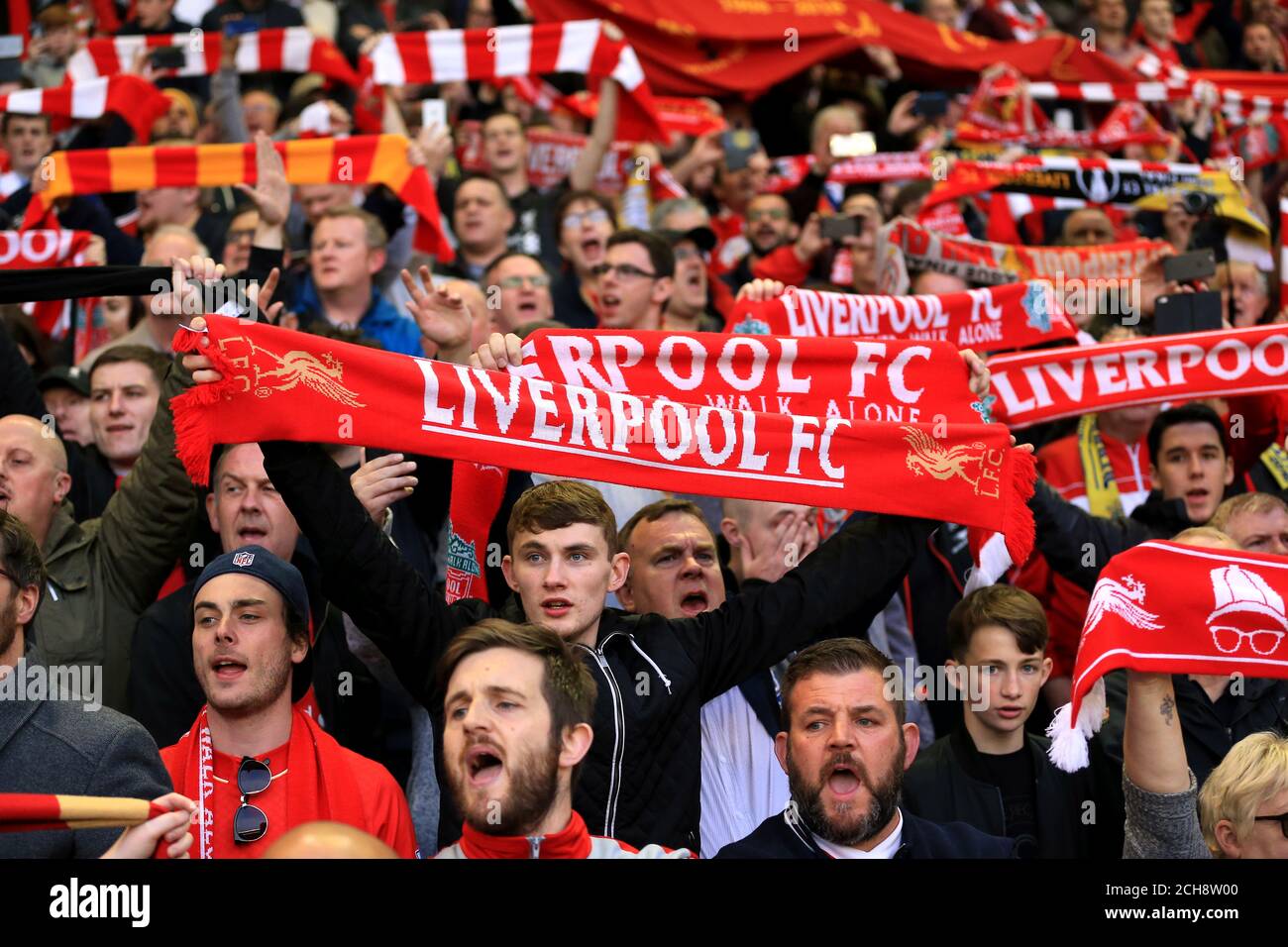 Liverpool fans in the stands Stock Photo - Alamy