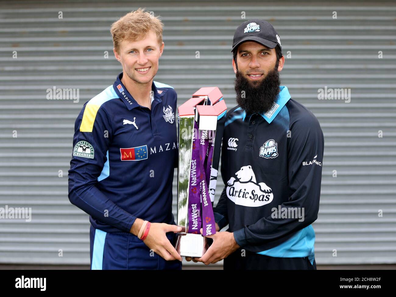Moeen Ali (right) and Joe Root pose with the Natwest T20 blast trophy ...