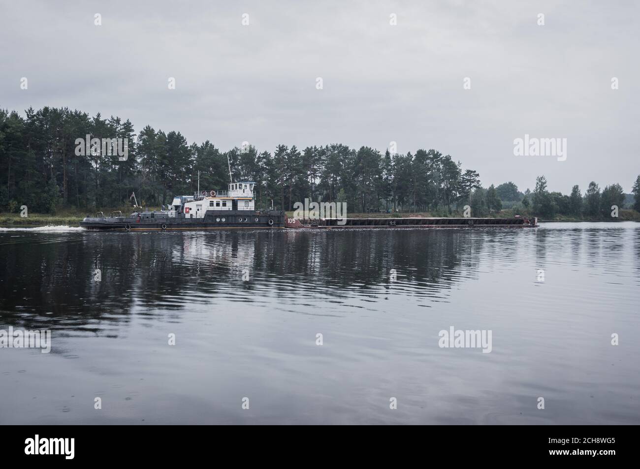 the barge is floating on a small river Stock Photo - Alamy