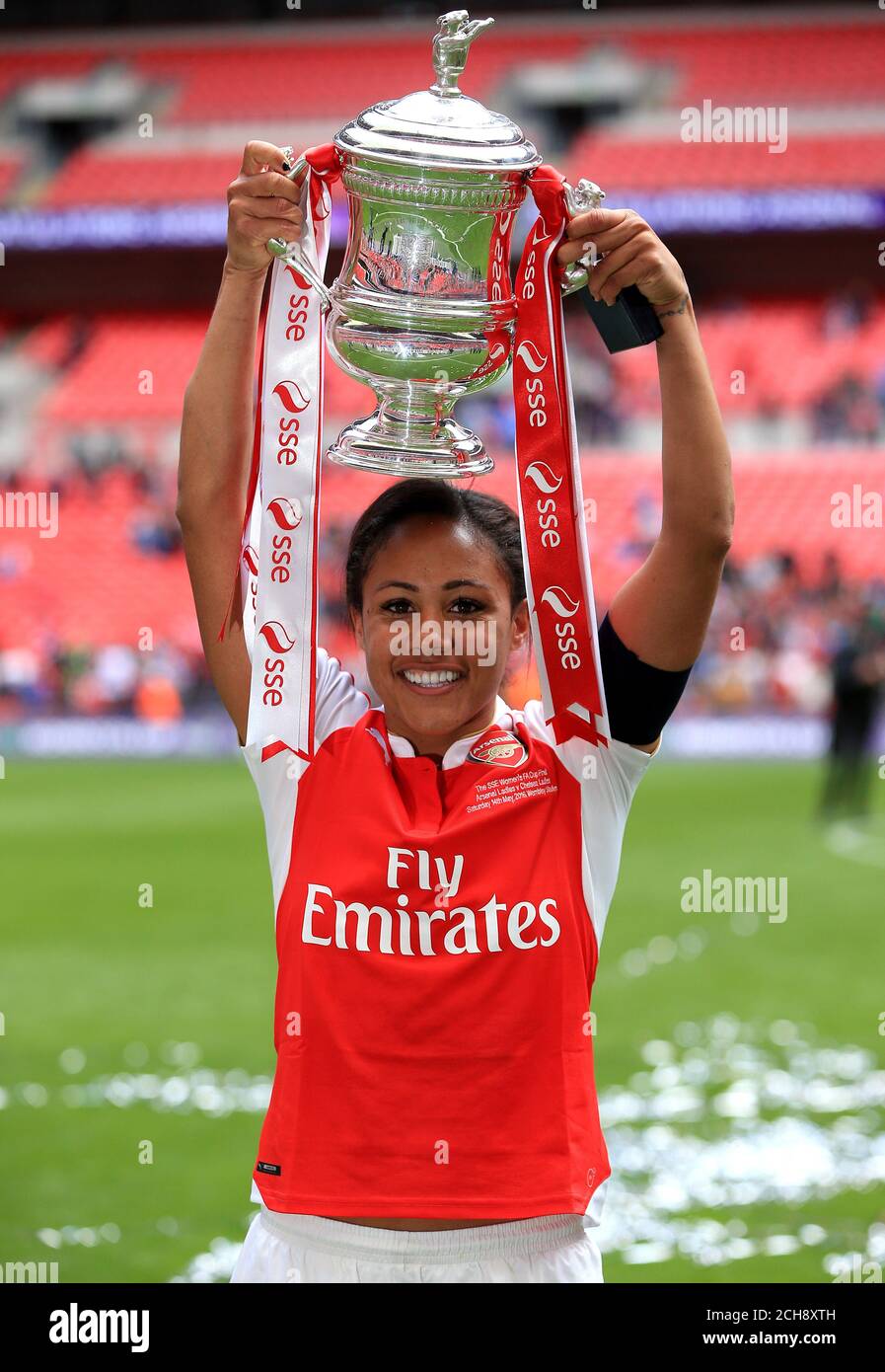 Arsenal's Alex Scott holds the trophy and celebrates after winning the ...
