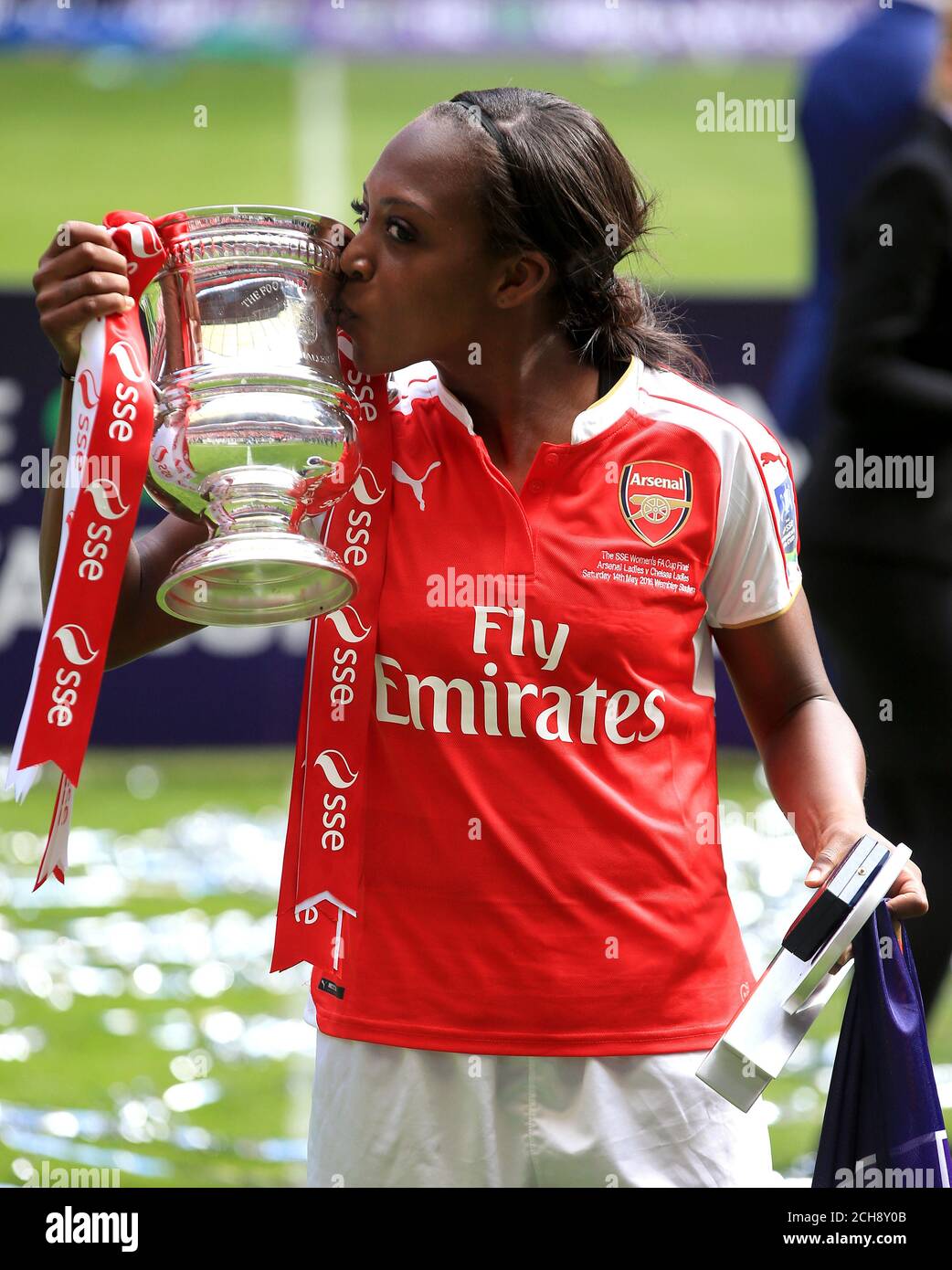 Arsenal's Danielle Carter celebrates with the trophy after winning the ...