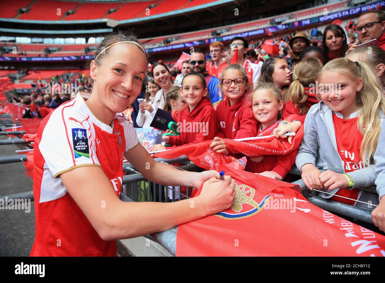 Arsenal's Casey Stoney signs autographs for fans after winning the SSE ...