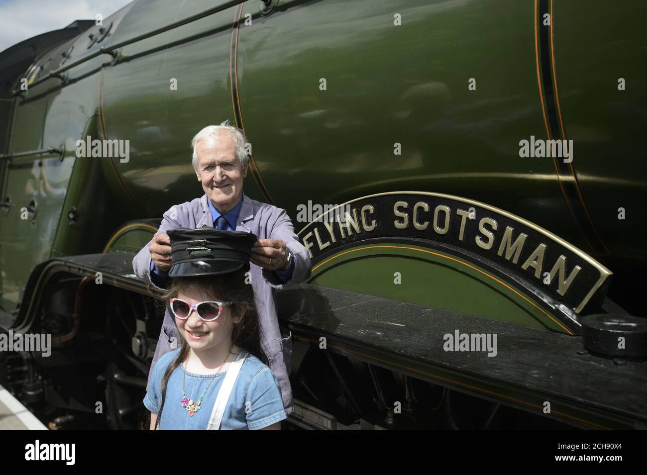 Engine fireman Gordon Hodgson, 77, from Carlisle, puts his hat on a ...