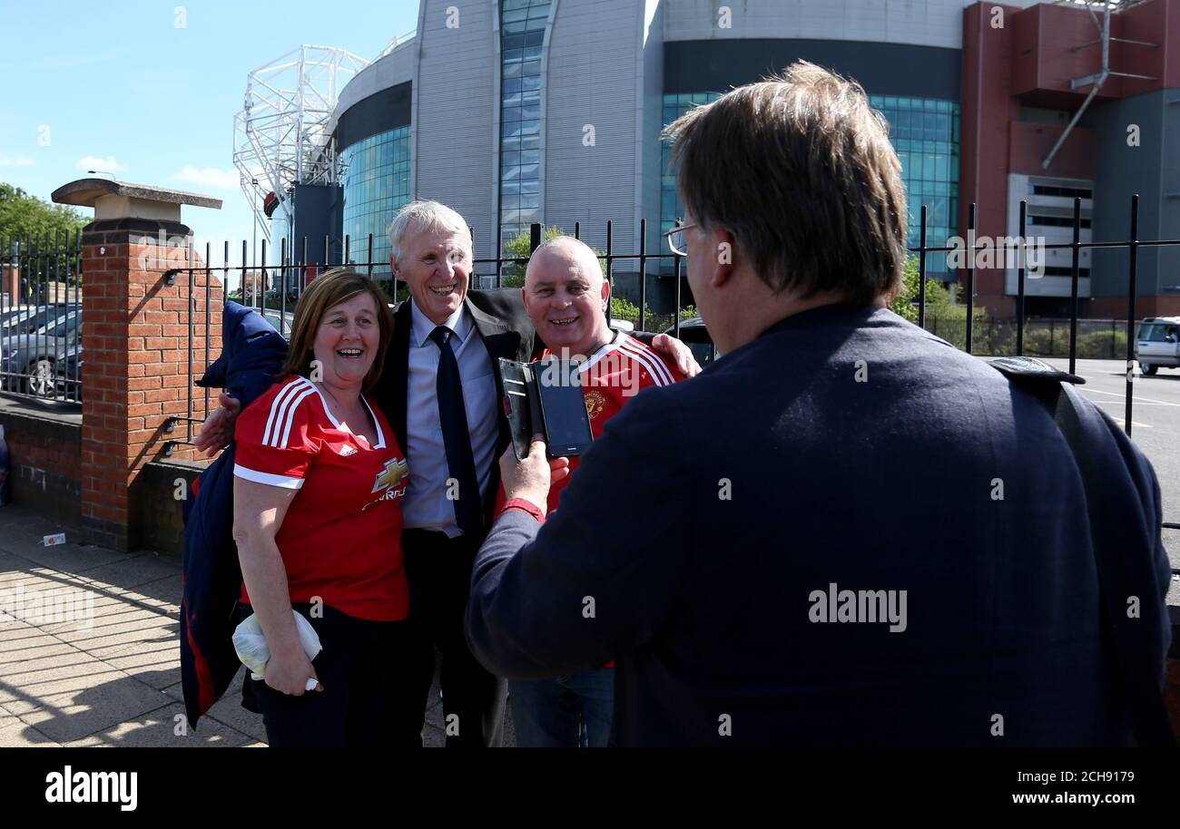 Former Manchester United player Paddy Crerand poses for a photo with ...