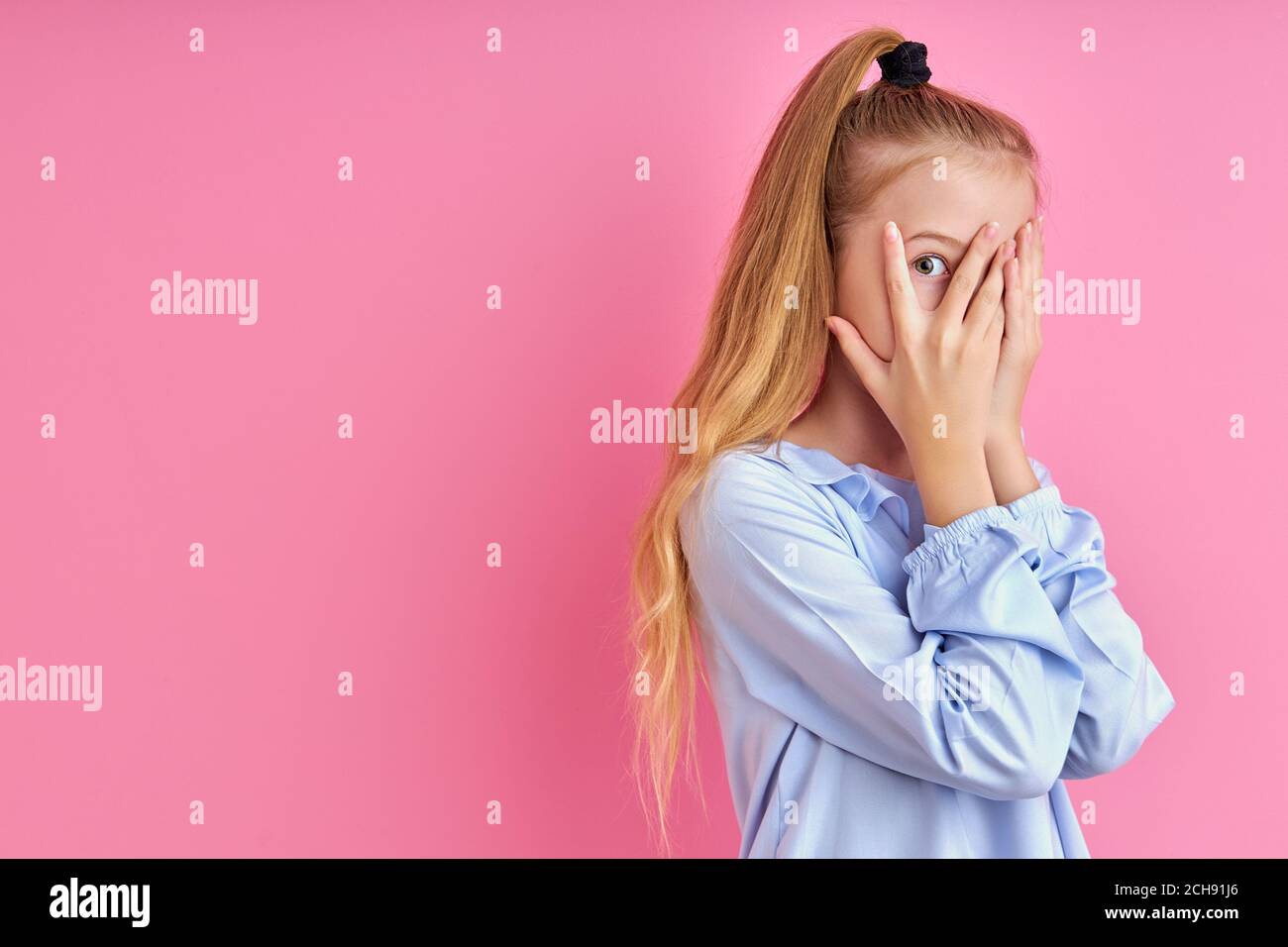 frightened little girl closed her eyes, she is scared, afraid of ...