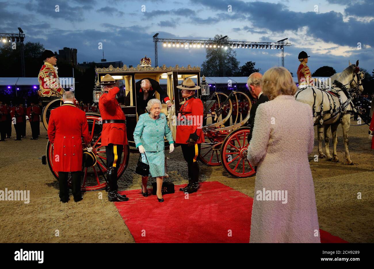 Queen Elizabeth II is greeted by the Prince of Wales and the Duchess of ...