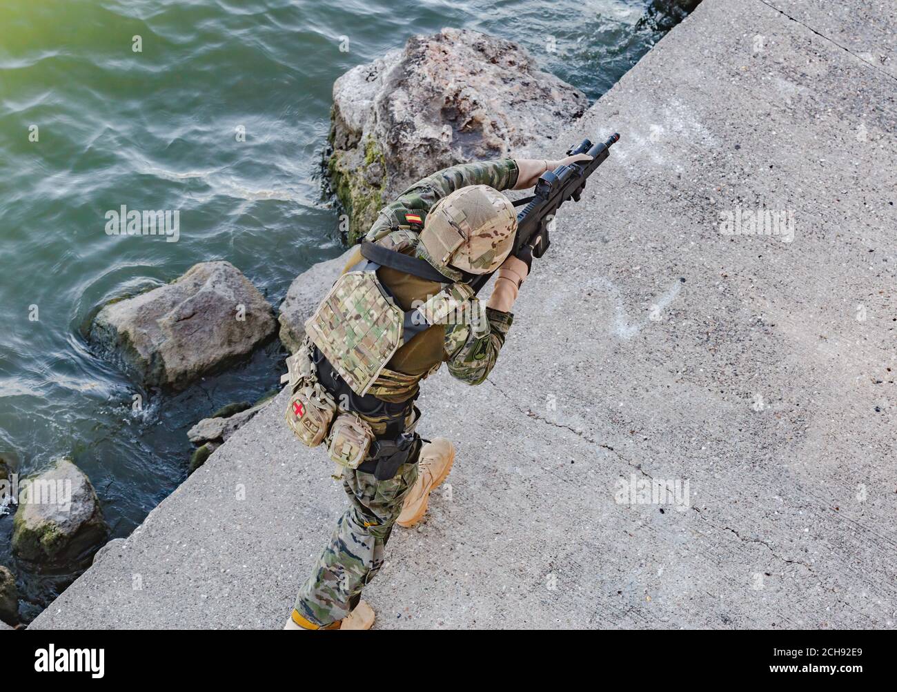 Army soldier in Combat Uniforms with assault rifle. Military equipment ...