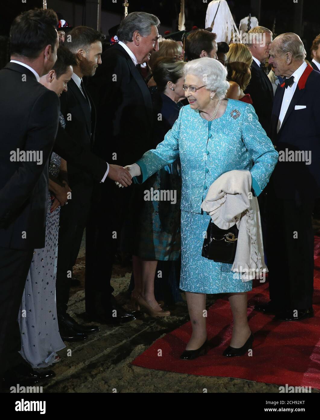 Queen Elizabeth II greets Gary Barlow during the televised celebration ...