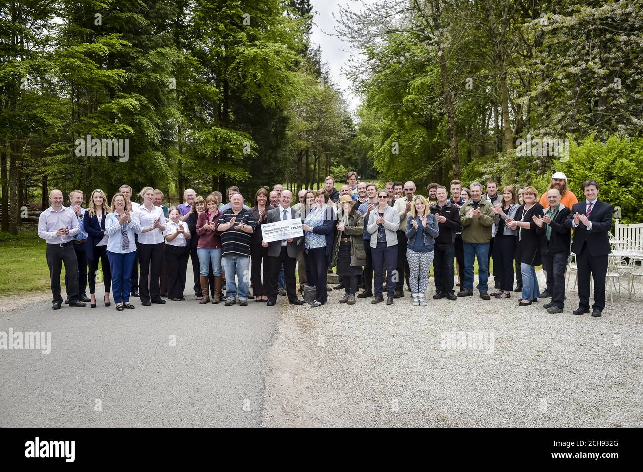 Receiving a cheque for a hi-res stock photography and images - Alamy