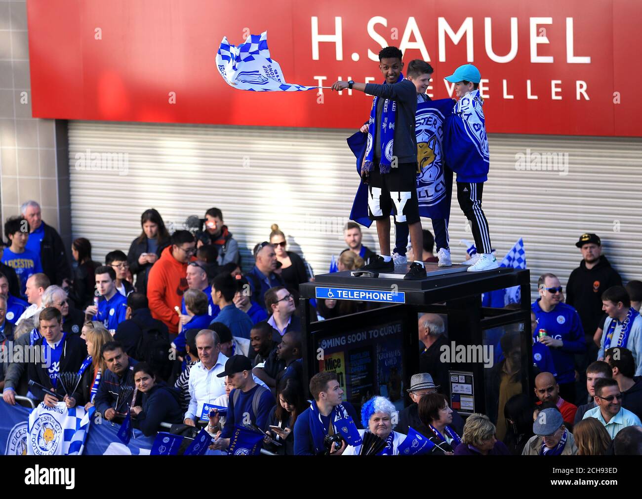 Leicester City fans line the route ahead of the open top bus parade ...