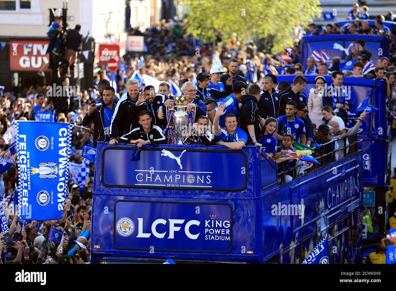 Leicester City's team celebrate on the bus during the open top bus ...