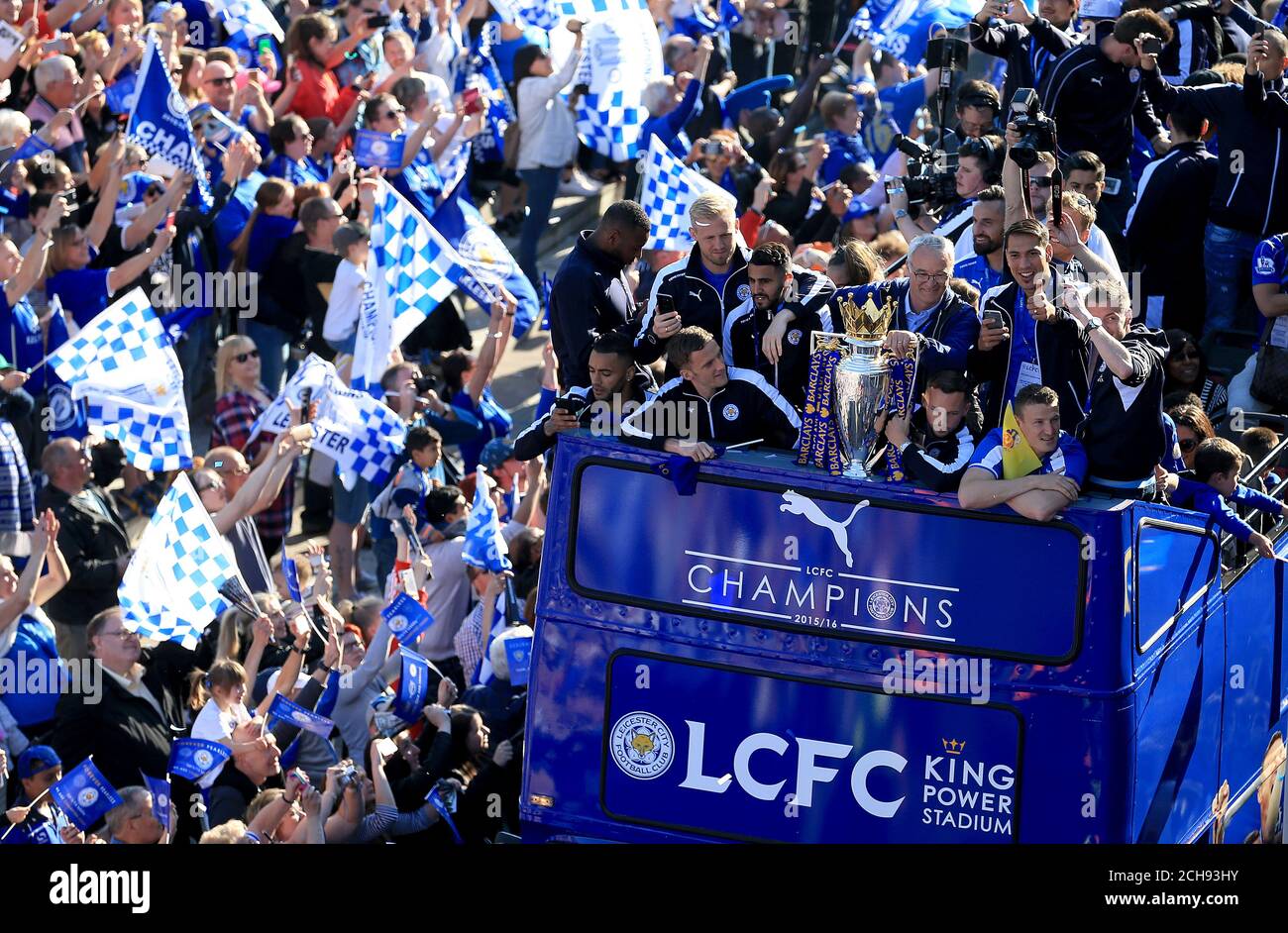 Leicester City players and staff celebrate with the trophy during the ...