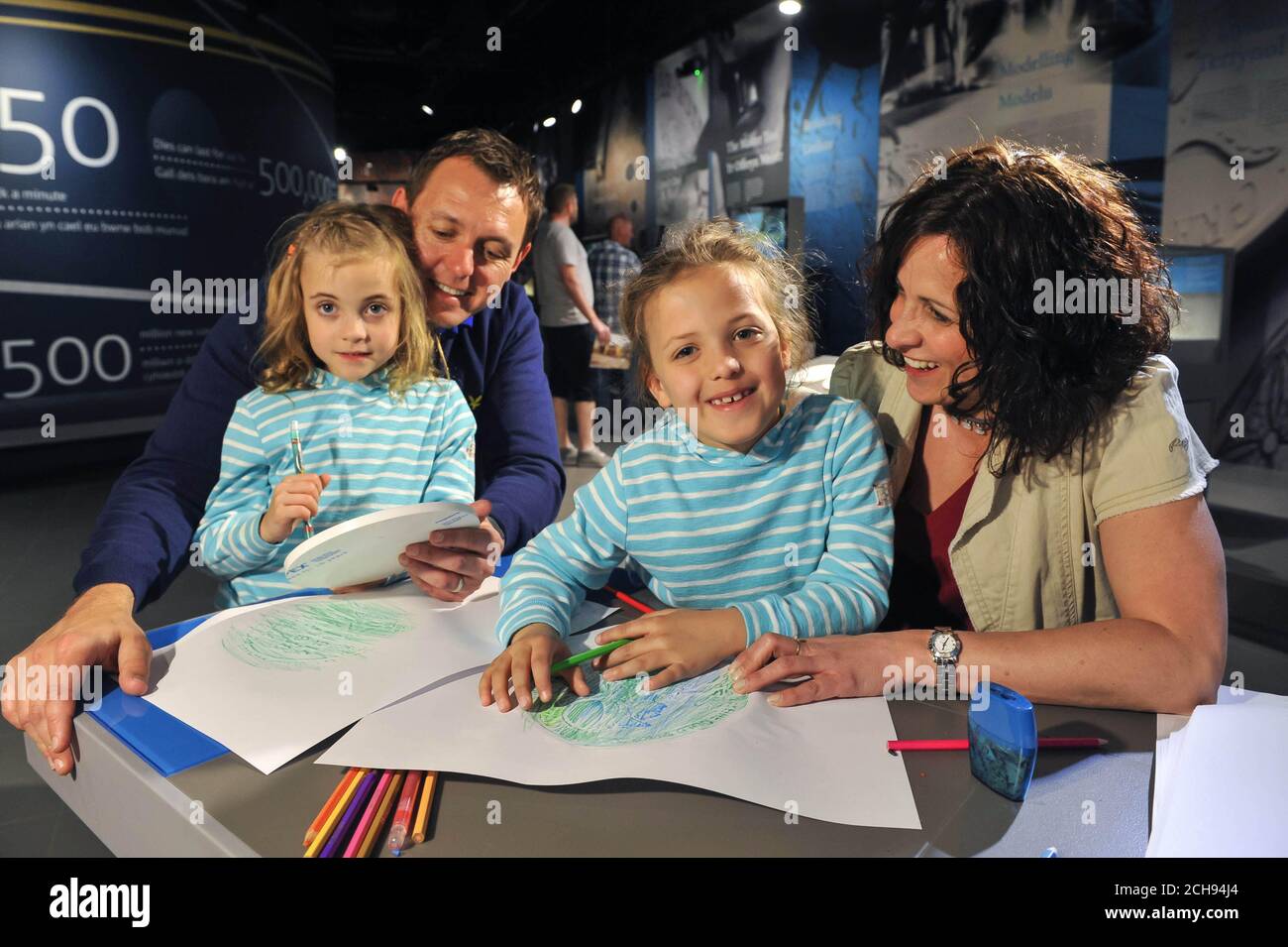 EDITORIAL USE ONLY Tayla and Seren Gibbs take rubbings from coin casts ...