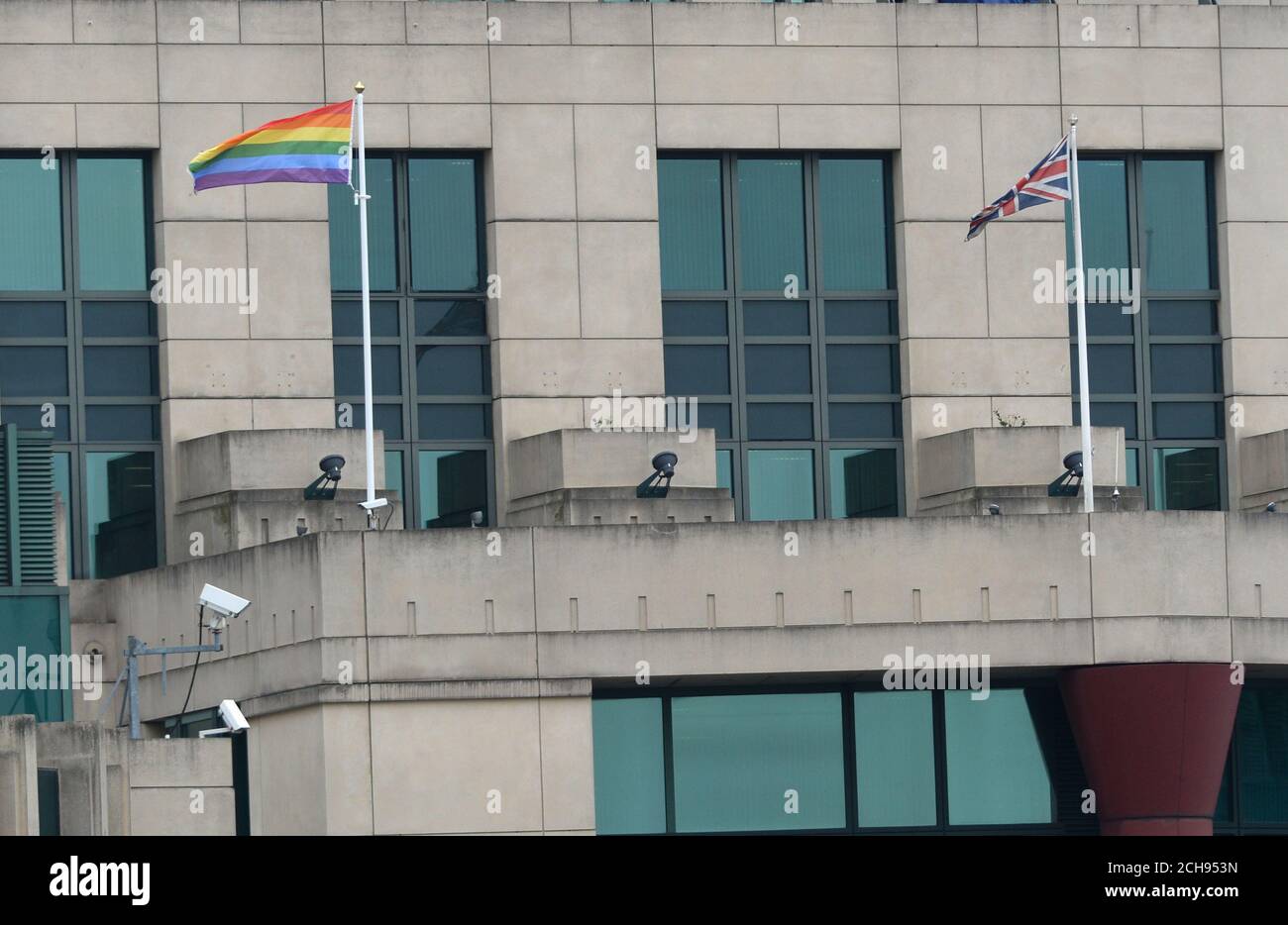 A Rainbow flag flies on the headquarters of MI6 headquarters to mark ...
