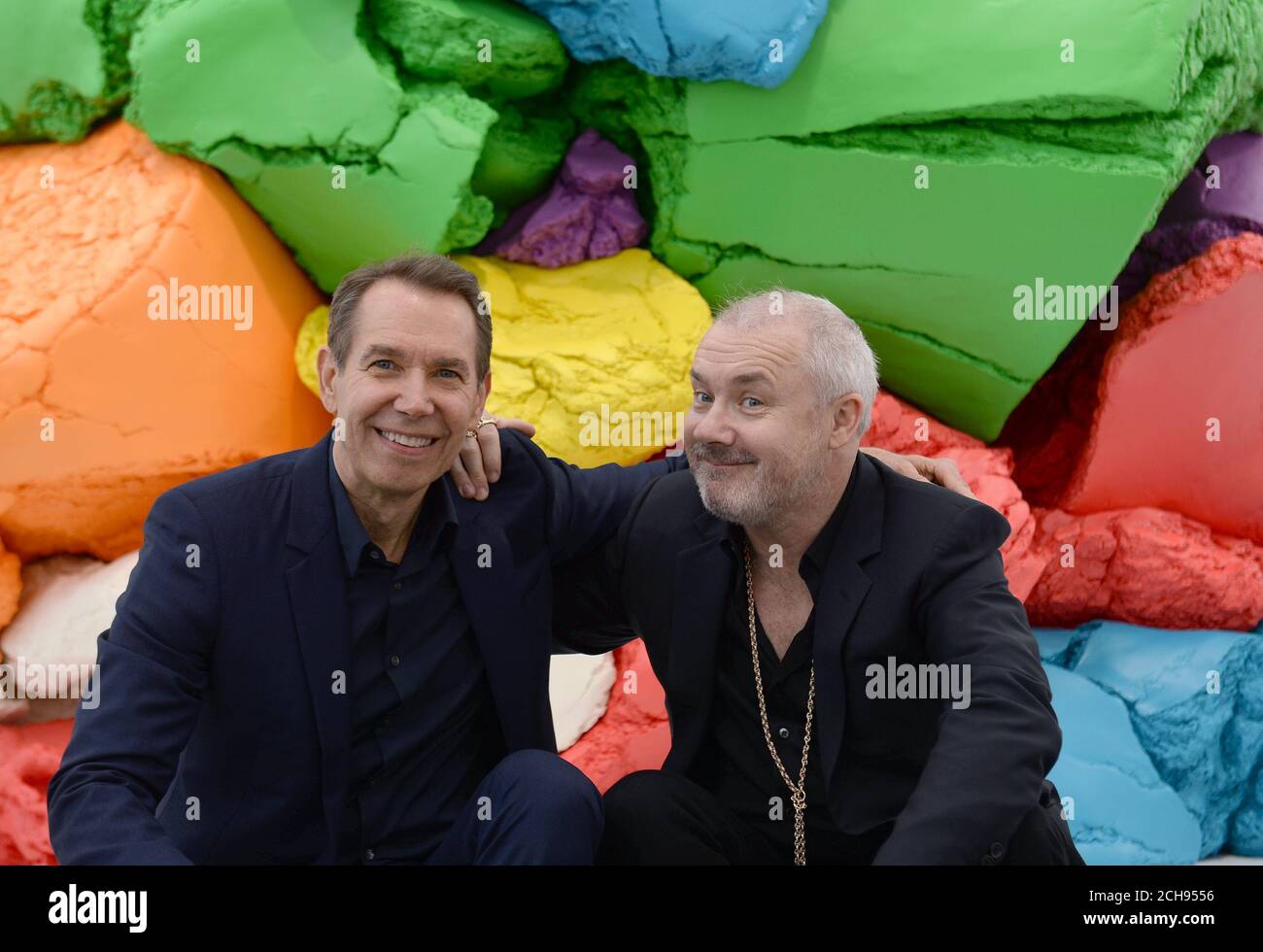 Jeff Koons (left) poses with Damien Hirst beside his sculpture Play-Doh ...