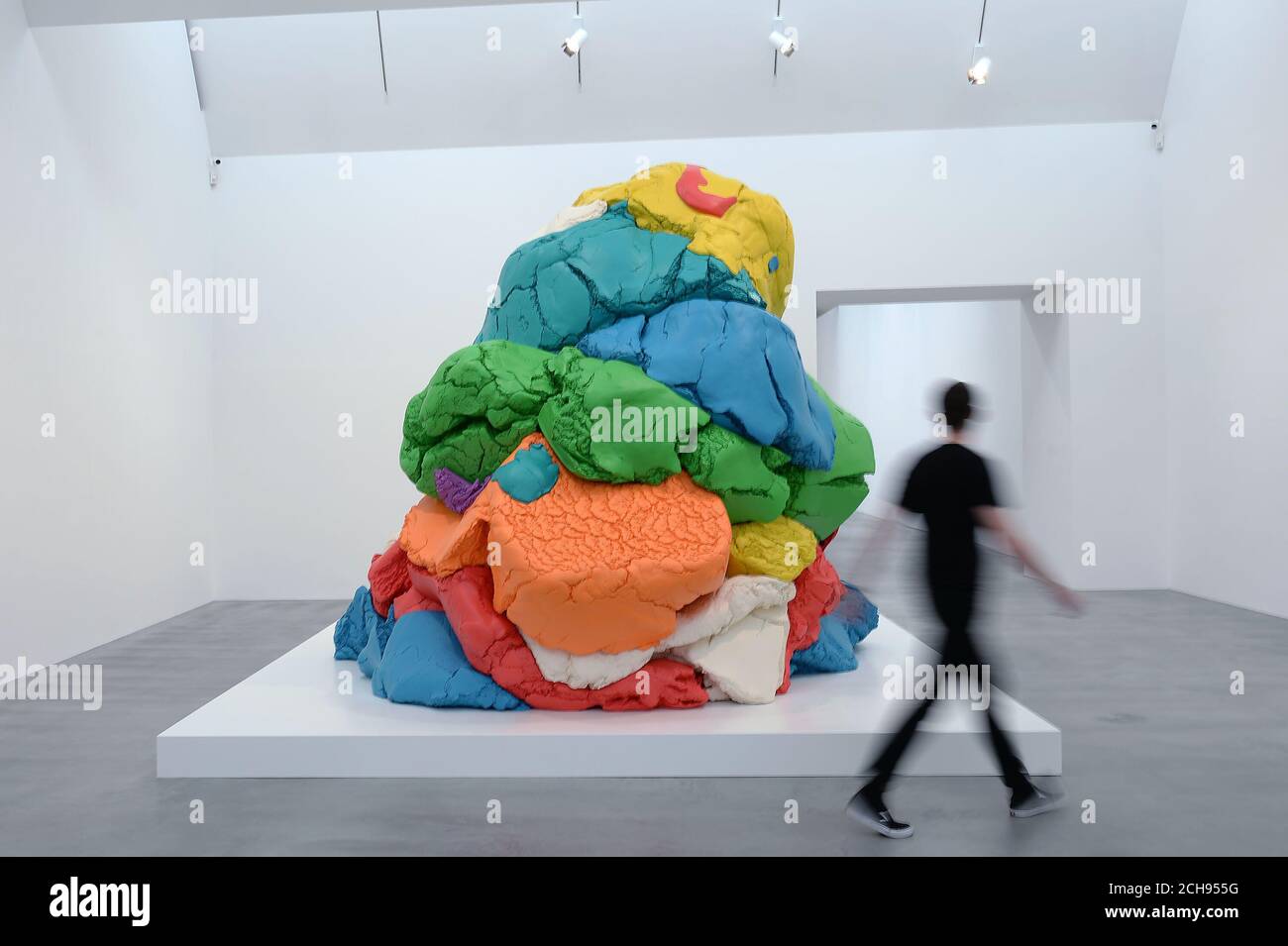 A man views Jeff Koons' sculpture Play-Doh 1994-2014 during the opening ...