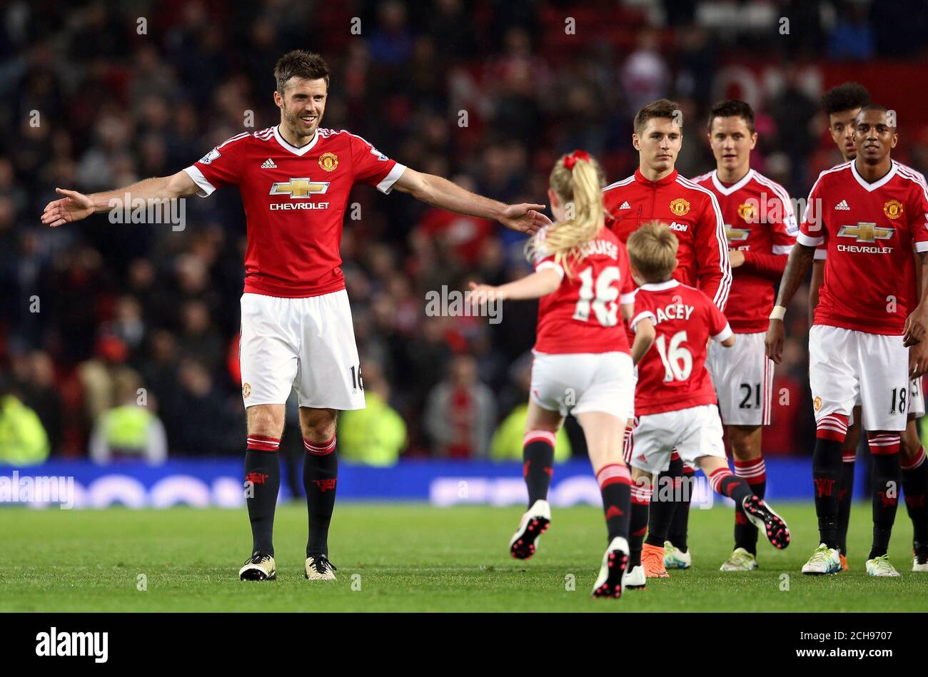 Manchester United's Michael Carrick on the pitch with his family on the ...