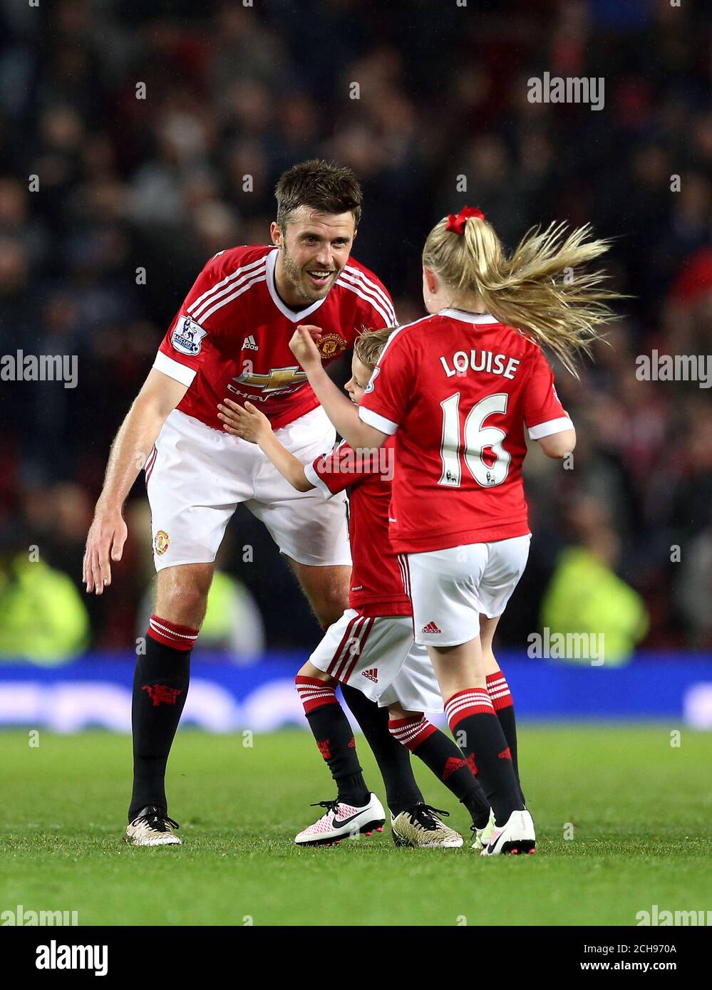 Manchester United's Michael Carrick on the pitch with his family on the ...