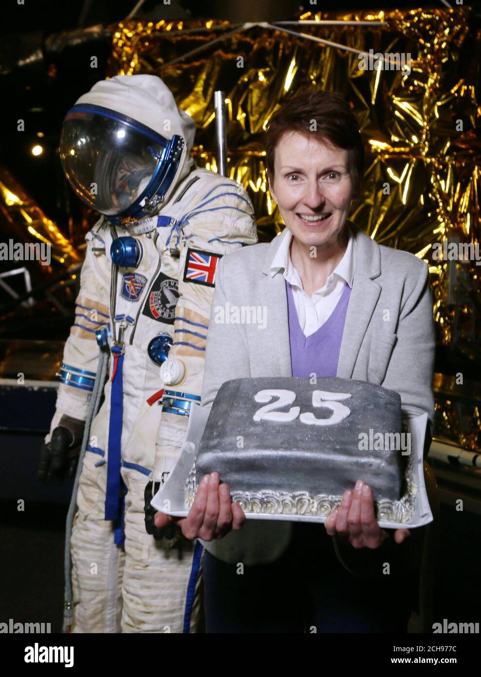 Britain's first astronaut Helen Sharman holds an anniversary cake at ...