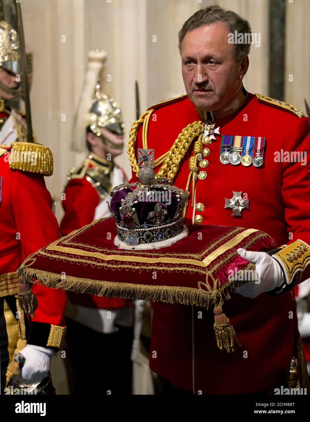 Queen Elizabeth II's Imperial State Crown is carried through Norman ...