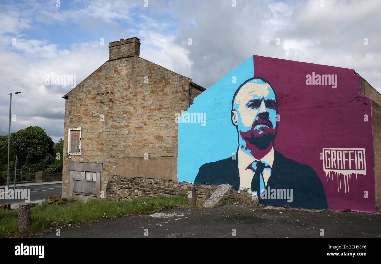 A mural of Burnley manager Sean Dyche on a gable end in Burnley Stock ...