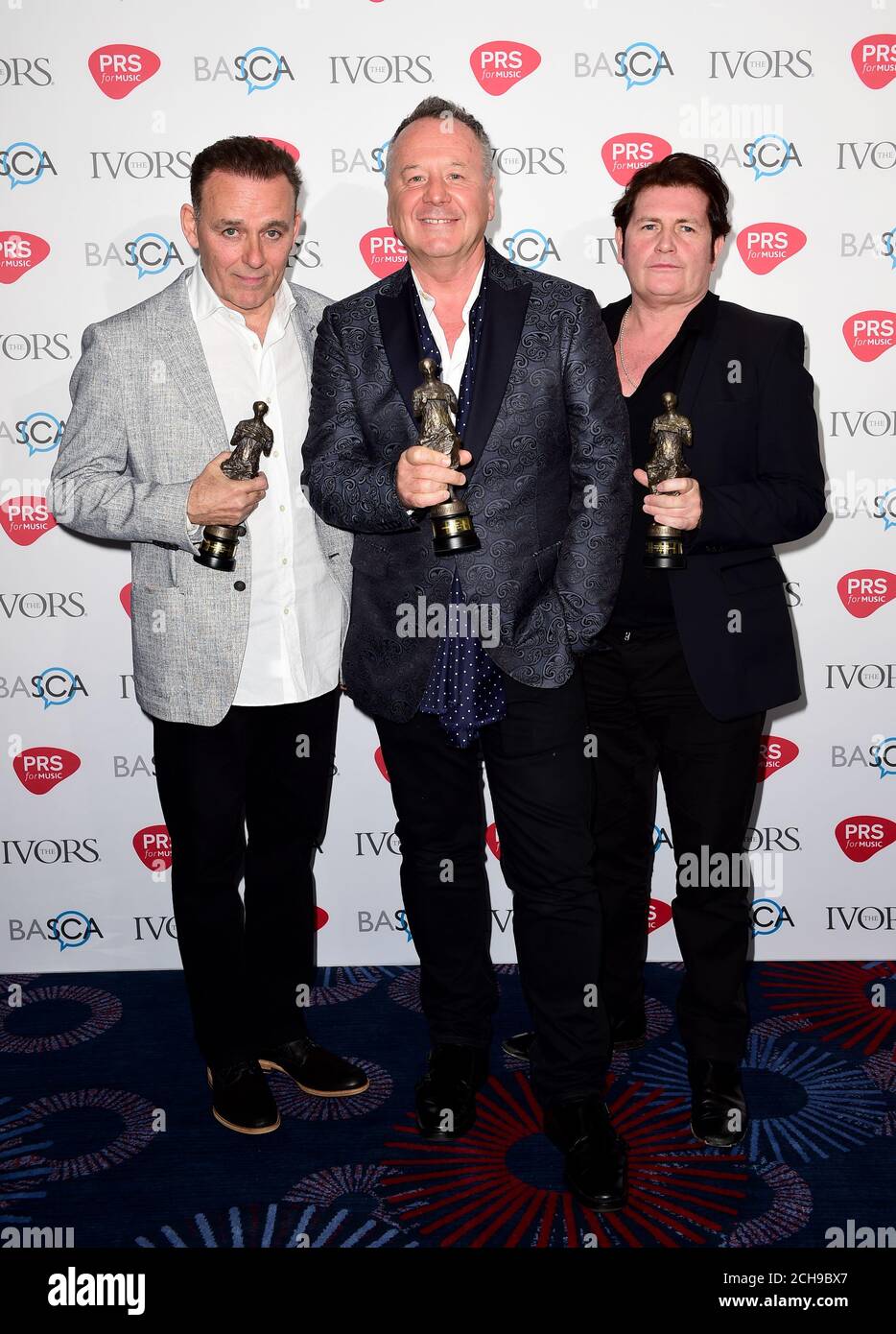(left to right) Mick MacNeil, Jim Kerr and Charlie Burchill of Simple ...
