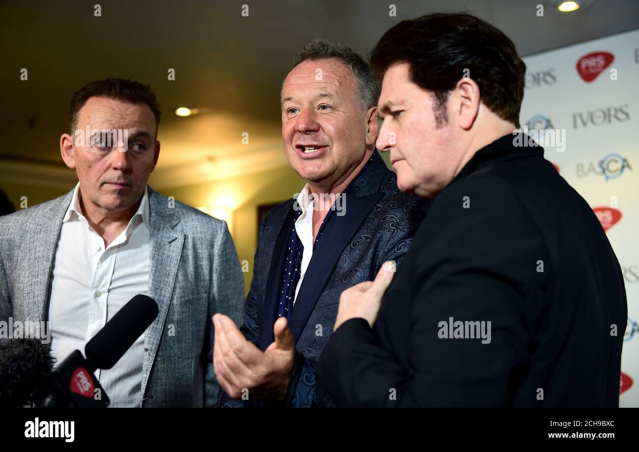 (left to right) Mick MacNeil, Jim Kerr and Charlie Burchill of Simple ...