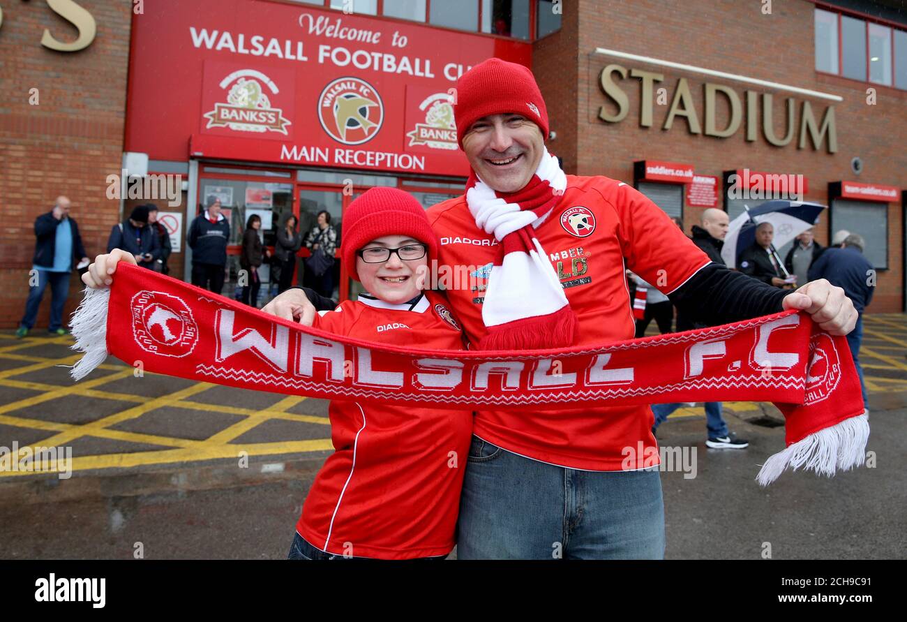 Walsall fans Tom (left) and Justin Whiting hold a scarf outside Banks's ...