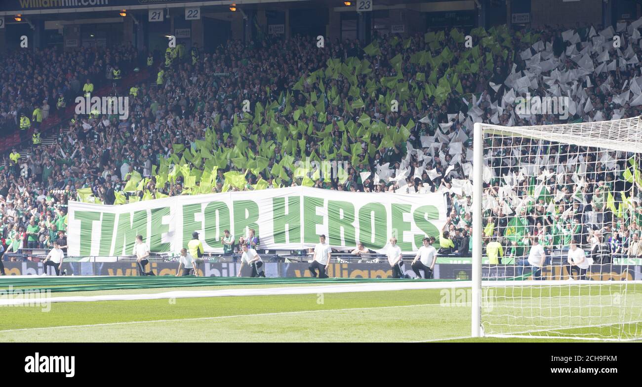 Hibernian fans display a banner reading "Time For Heroes" during the ...