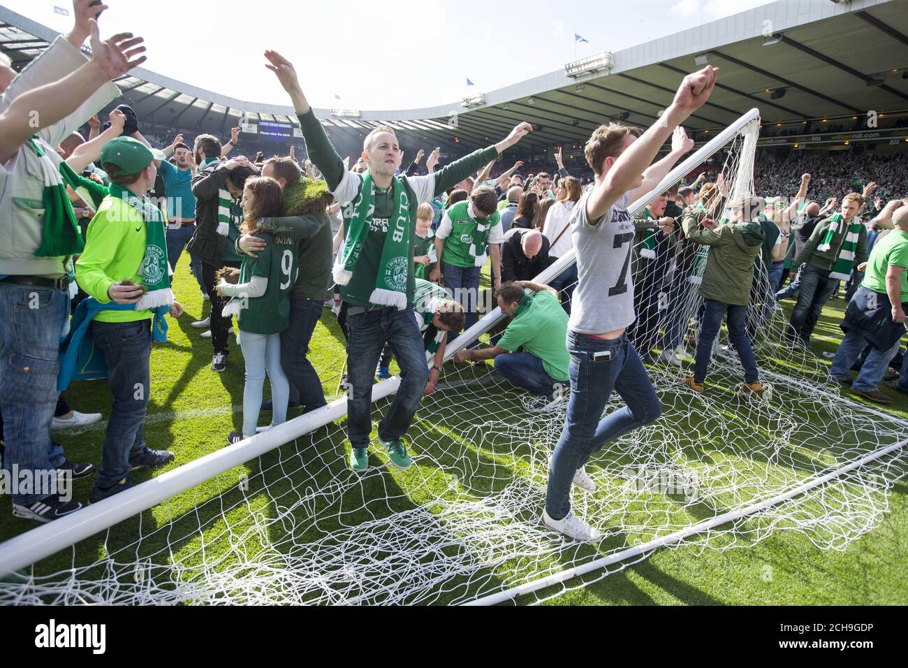 Hibernian fans invade the pitch after the William Hill Scottish Cup ...