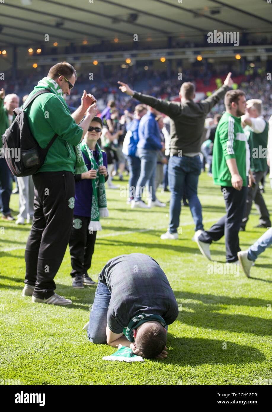 Hibernian fans invade the pitch after the William Hill Scottish Cup ...
