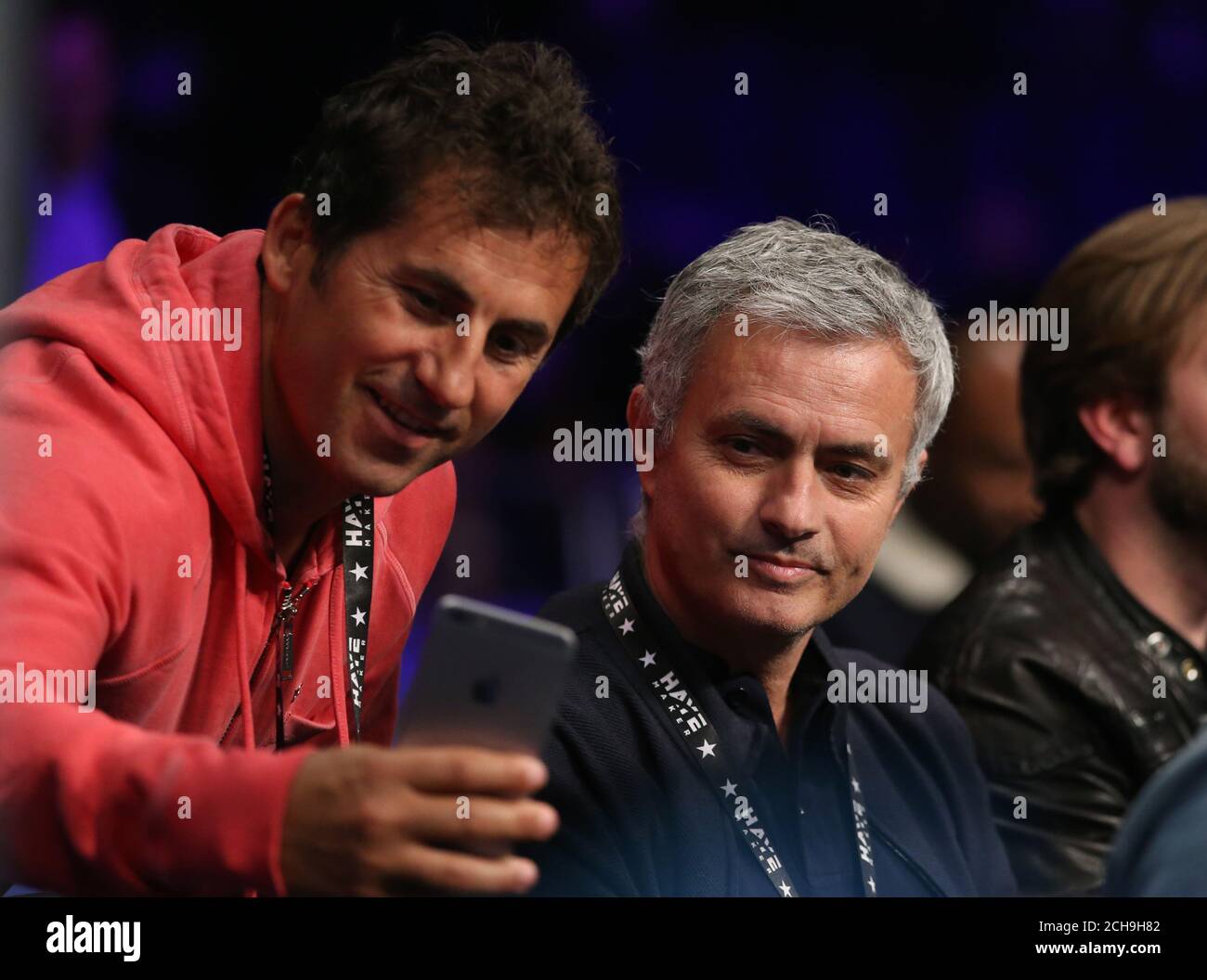A member of the crowd takes a picture with Jose Mourinho at the O2 ...