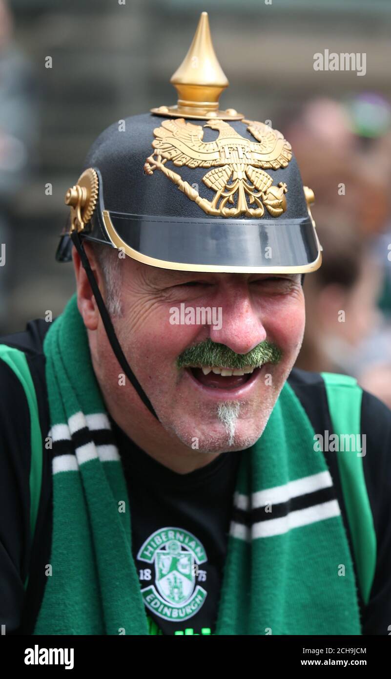 Hibernian fans watch the Scottish Cup winners travel down the Royal ...