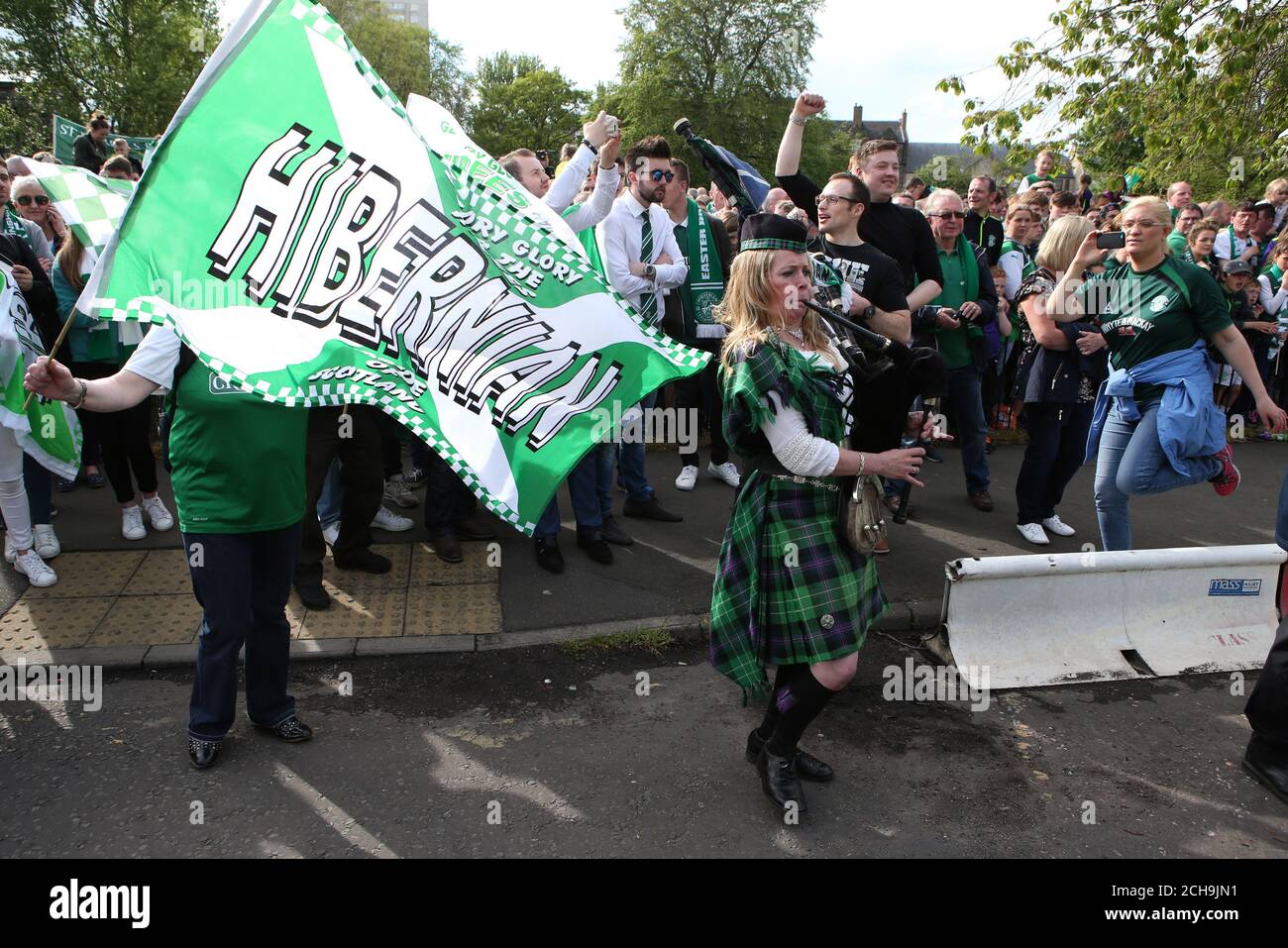 A Hibernian supporter plays the pipes to the crowd the at the Leith ...