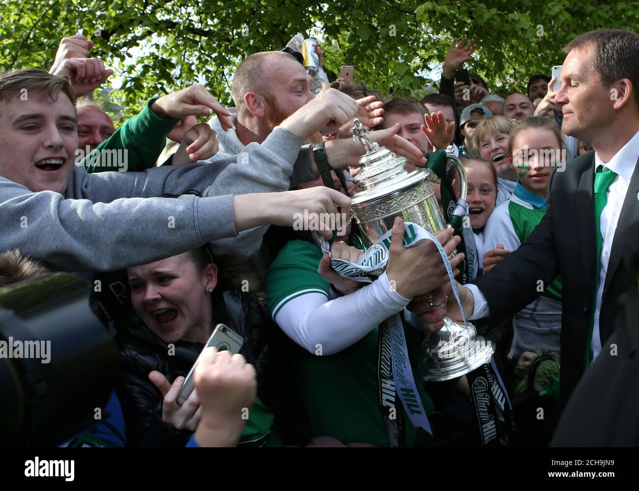 A Hibernian official shows the crowd the Scottish Cup at the Leith ...