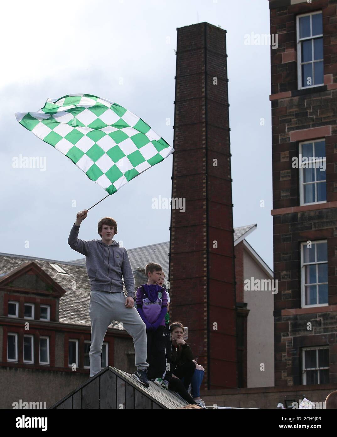 Hibernian supporters line the route at the Leith Links as the team ...